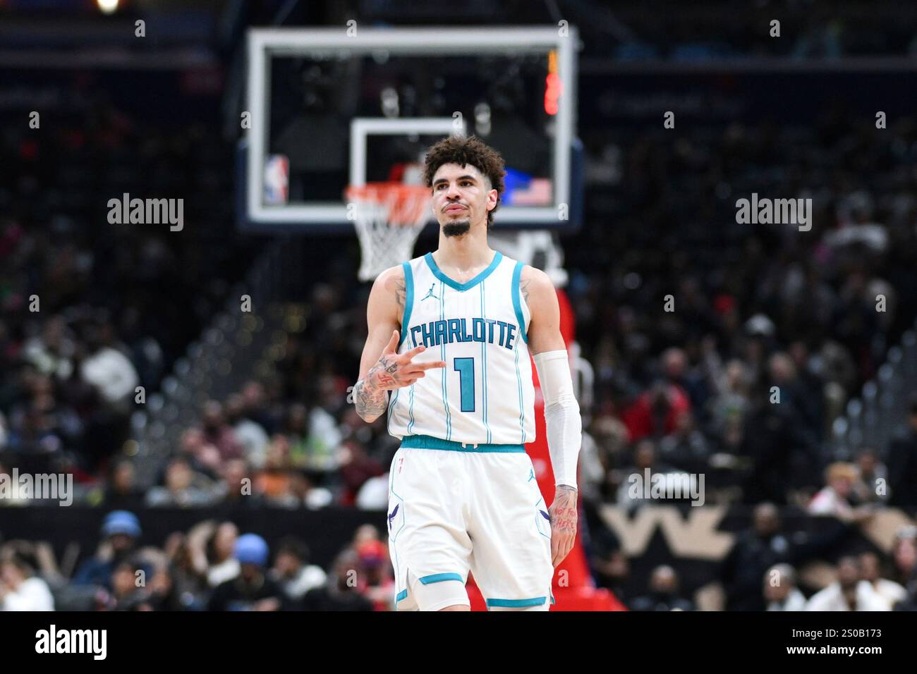 Charlotte Hornets guard LaMelo Ball gestures after scoring a 3-point ...
