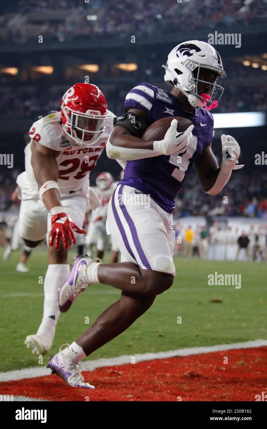 Phoenix, Arizona, USA. 26th Dec, 2024. Kansas State Wildcats running ...