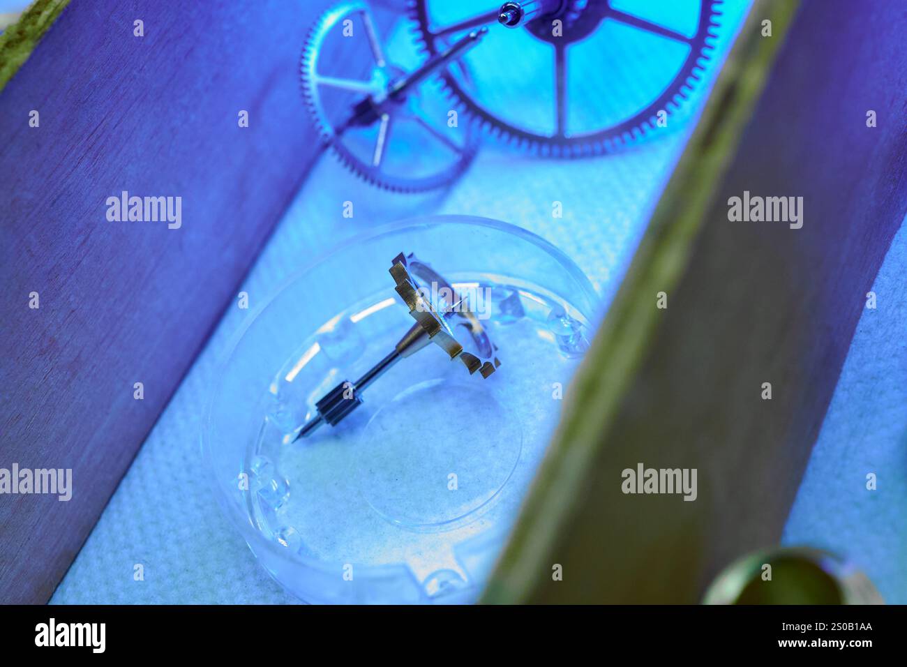 Intricate clockwork mechanism showcasing cogwheels and gears under ...