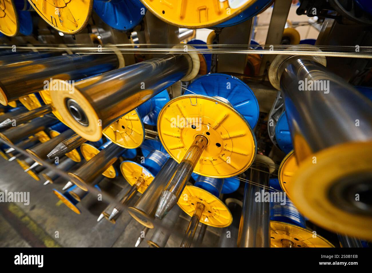 Bobbins coil thin wire to reinforce tires in plant workshop Stock Photo ...