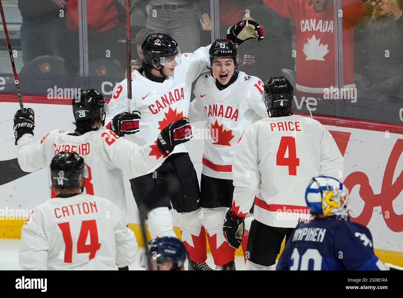 Canada forward Luca Pinelli (13) celebrates after his goal with forward ...