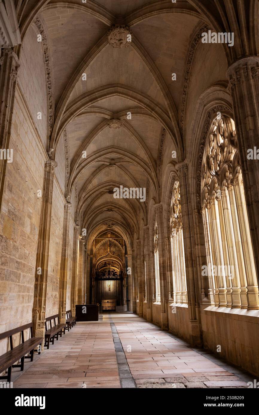 A walkway in the cloister of the 1300s gothic cathedral in Segovia ...