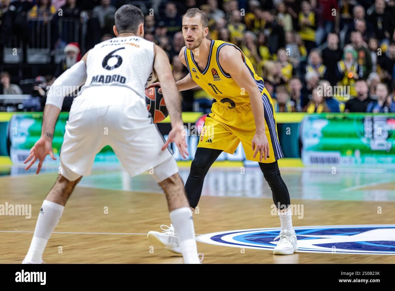 Berlin, Germany. 26th Dec, 2024. Matt Thomas (R) of Alba Berlin and ...