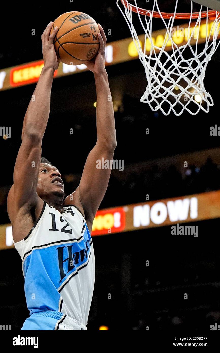 Atlanta Hawks forward De'Andre Hunter (12) goes to the hoop against the ...