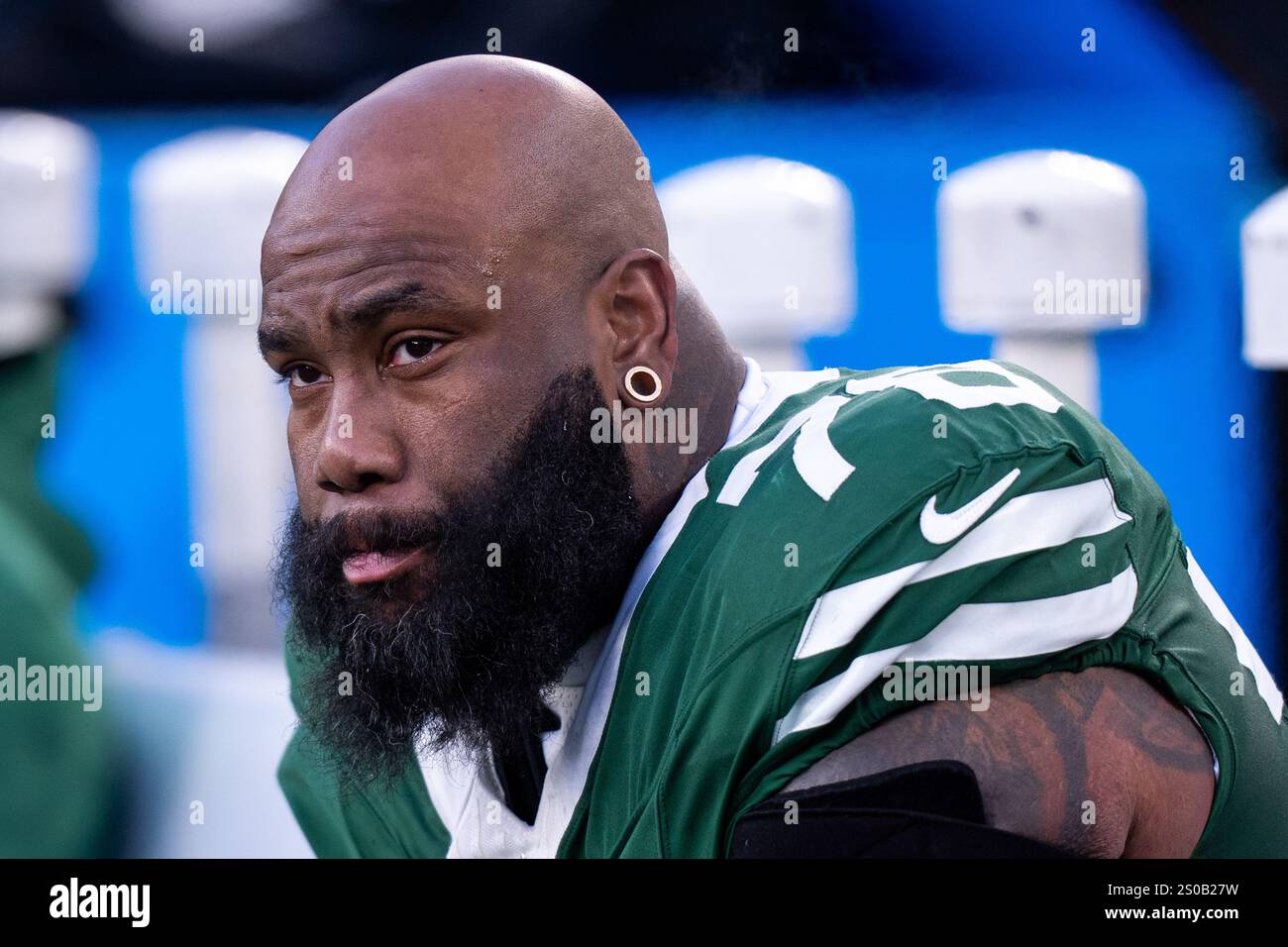 New York Jets offensive lineman Morgan Moses (78) looks on during the ...
