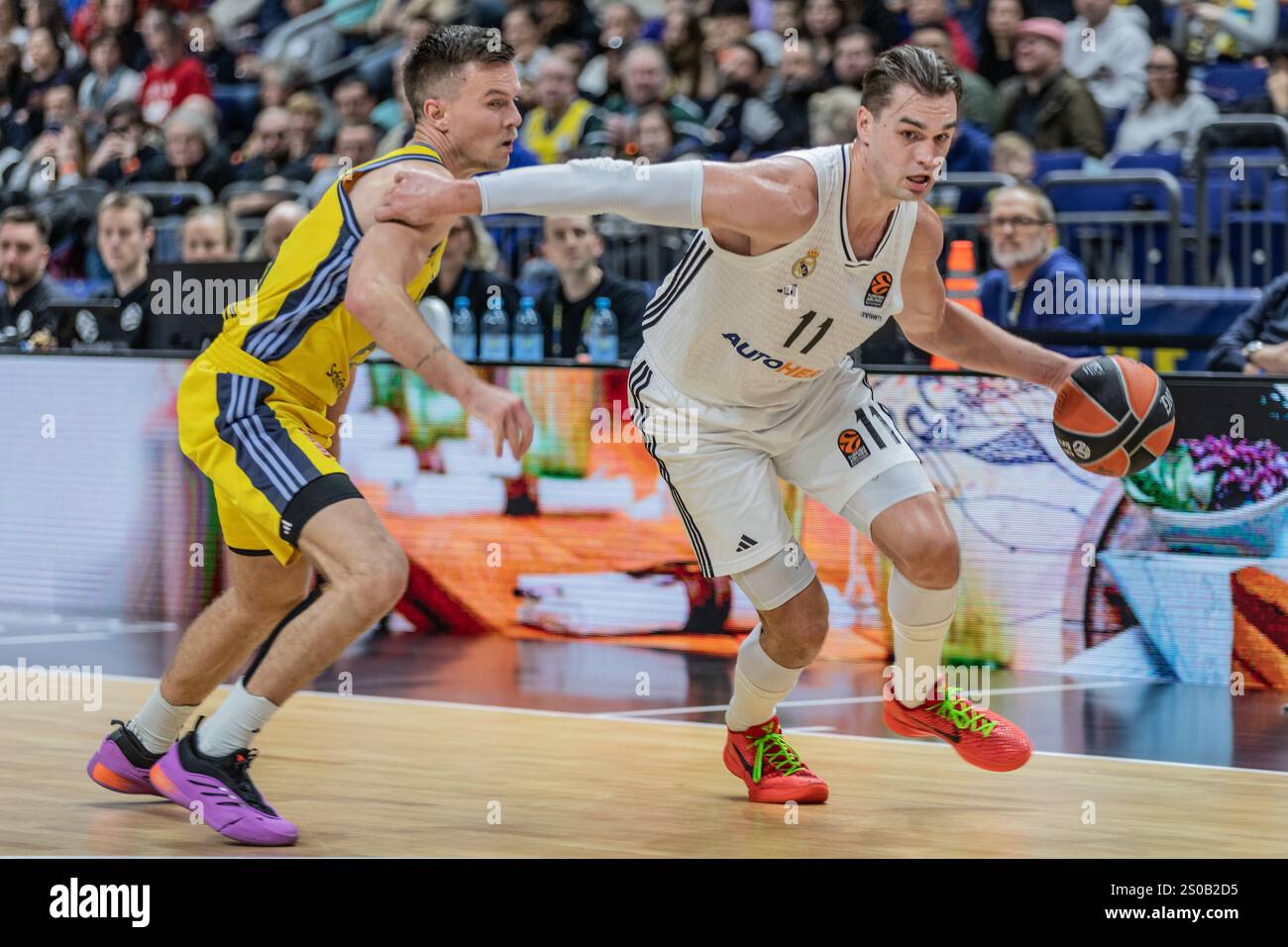 Mario Hezonja (R) of Real Madrid and Martin Hermannsson (L) of Alba ...