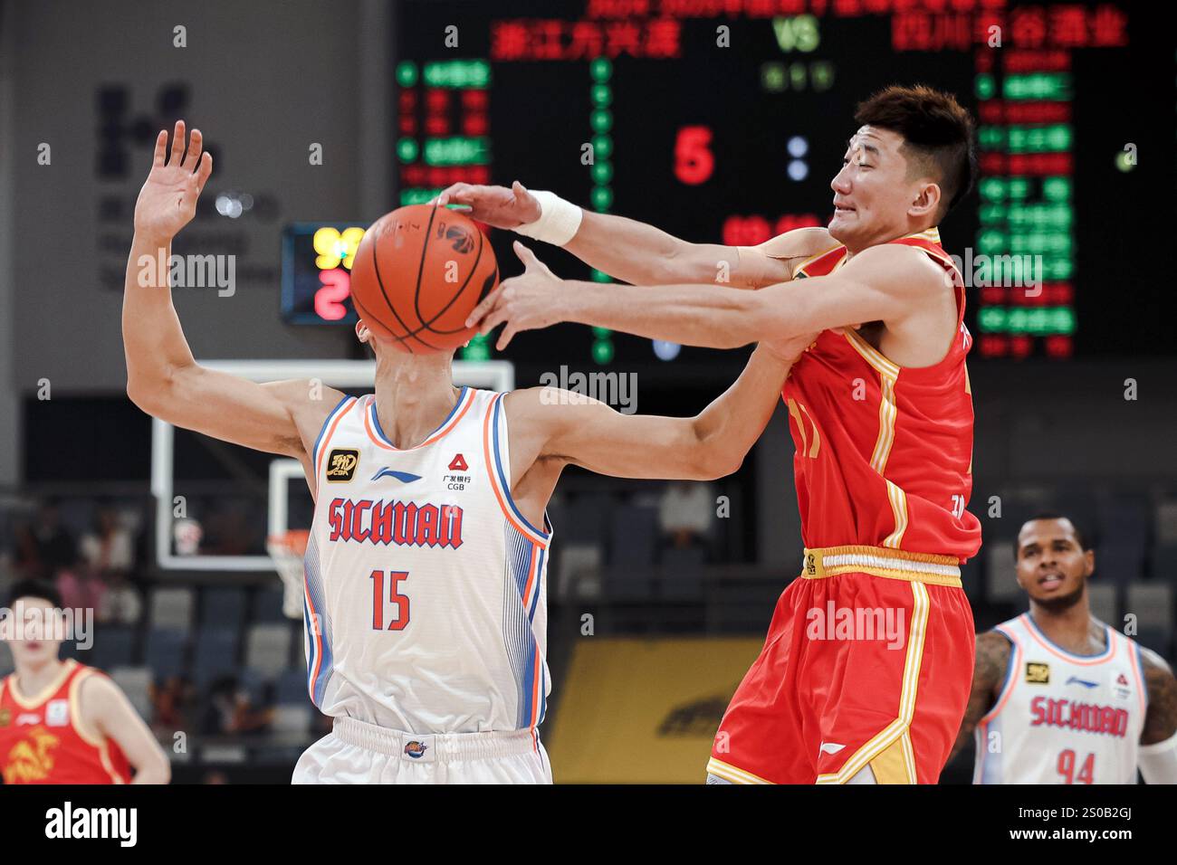 Beijing, China's Zhejiang Province. 26th Dec, 2024. Sun Minghui (front R) of Zhejiang Lions vies ...