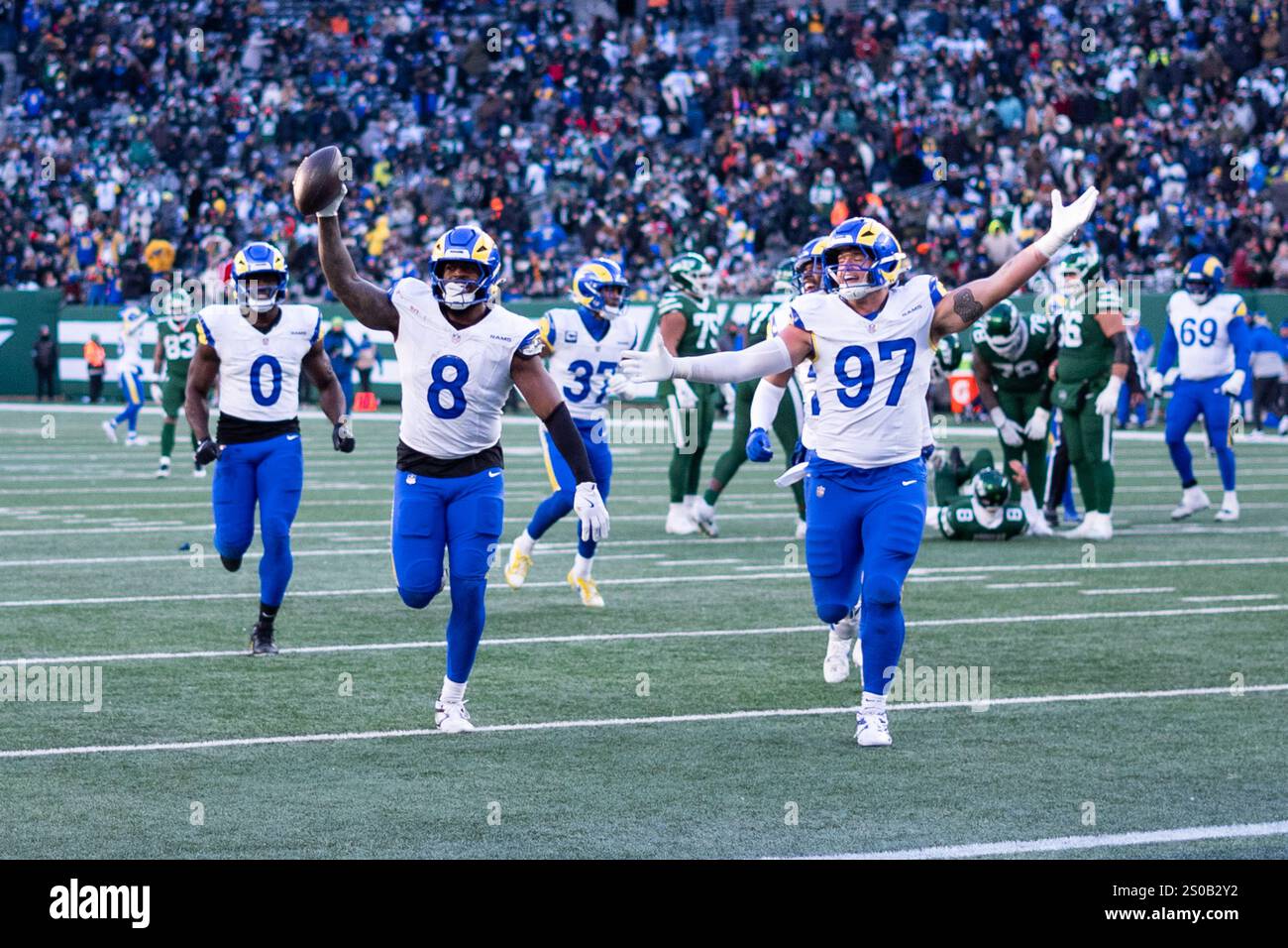 Los Angeles Rams linebacker Jared Verse (8) holds up the fumble ...