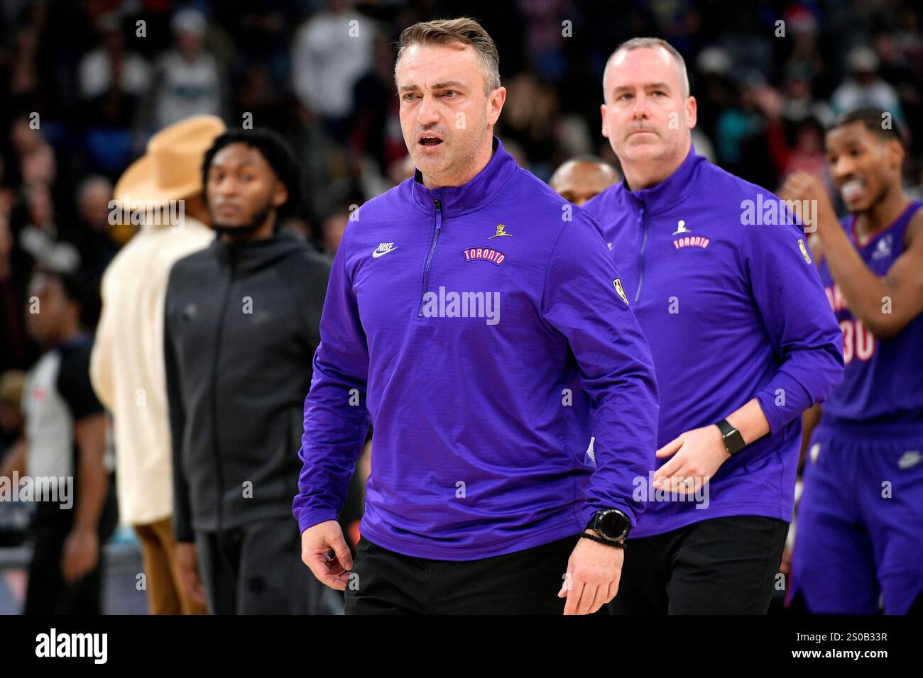 Toronto Raptors head coach Darko Rajakovic, center, walks off of the ...