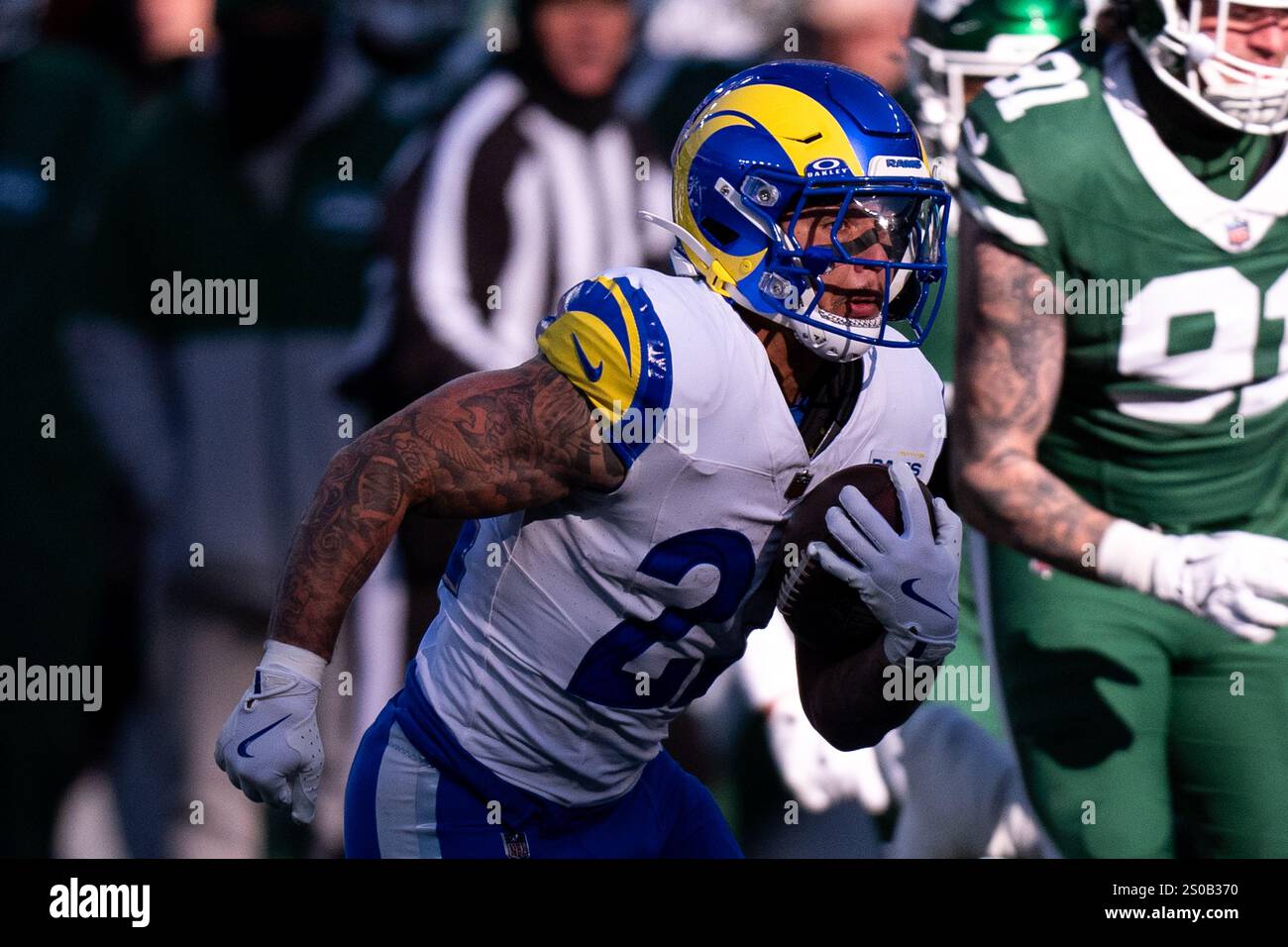Los Angeles Rams running back Blake Corum (22) runs with the ball during the NFL football game ...