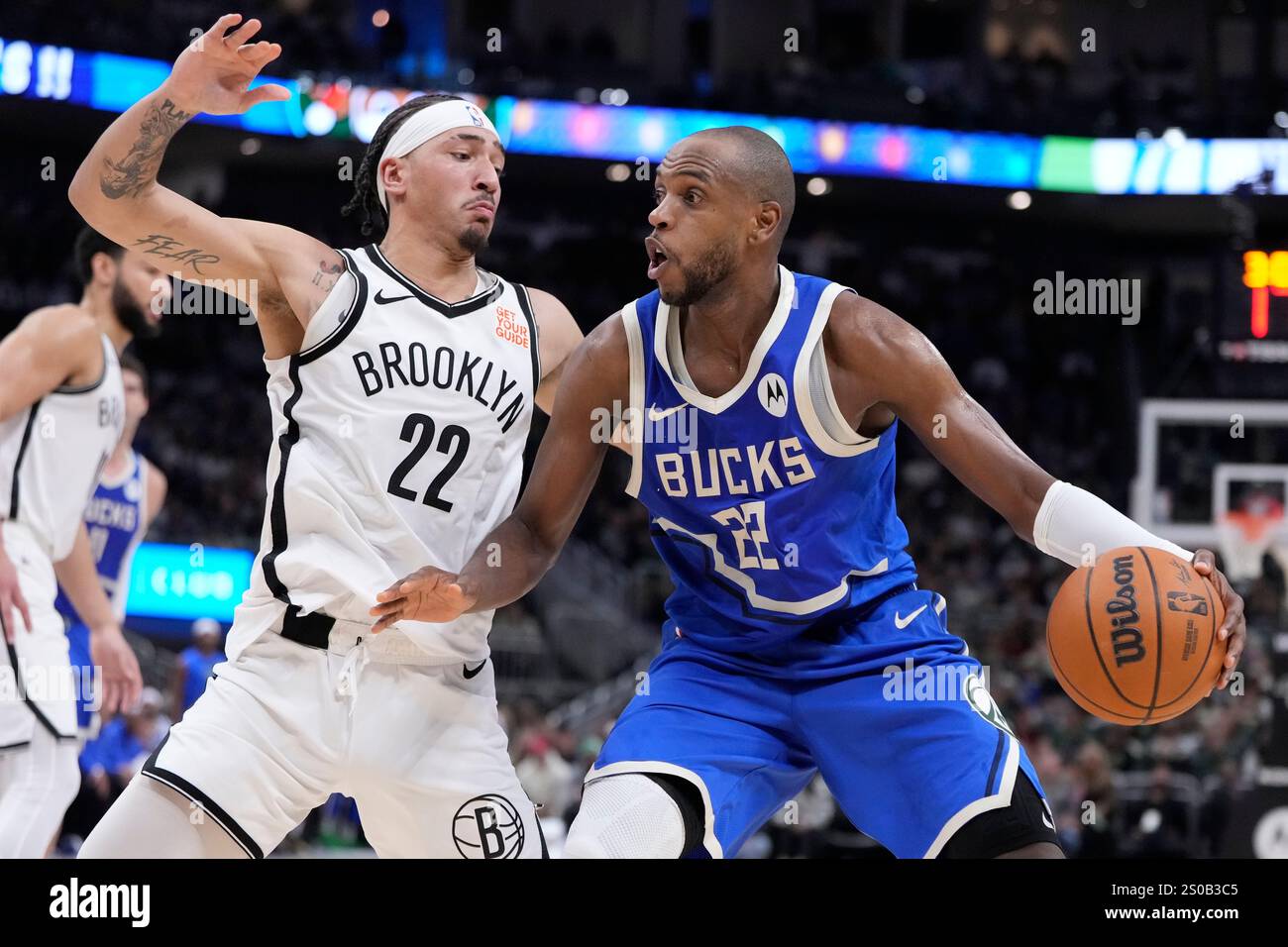 Milwaukee Bucks' Khris Middleton tries to get past Brooklyn Nets' Jalen ...