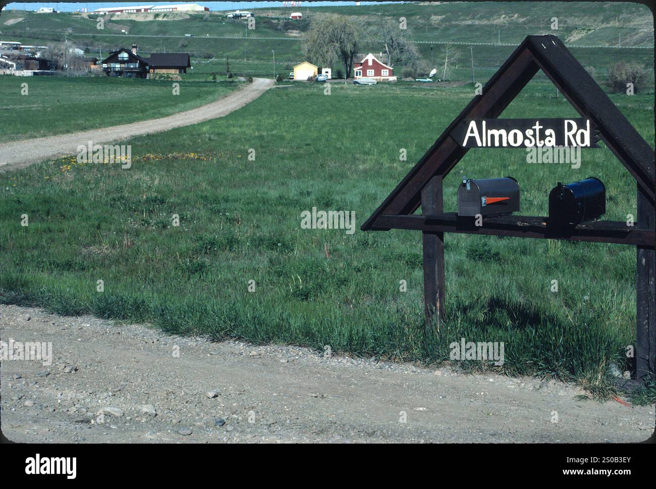 Rural roadside humor, Almosta Road sign and mail boxes Stock Photo - Alamy