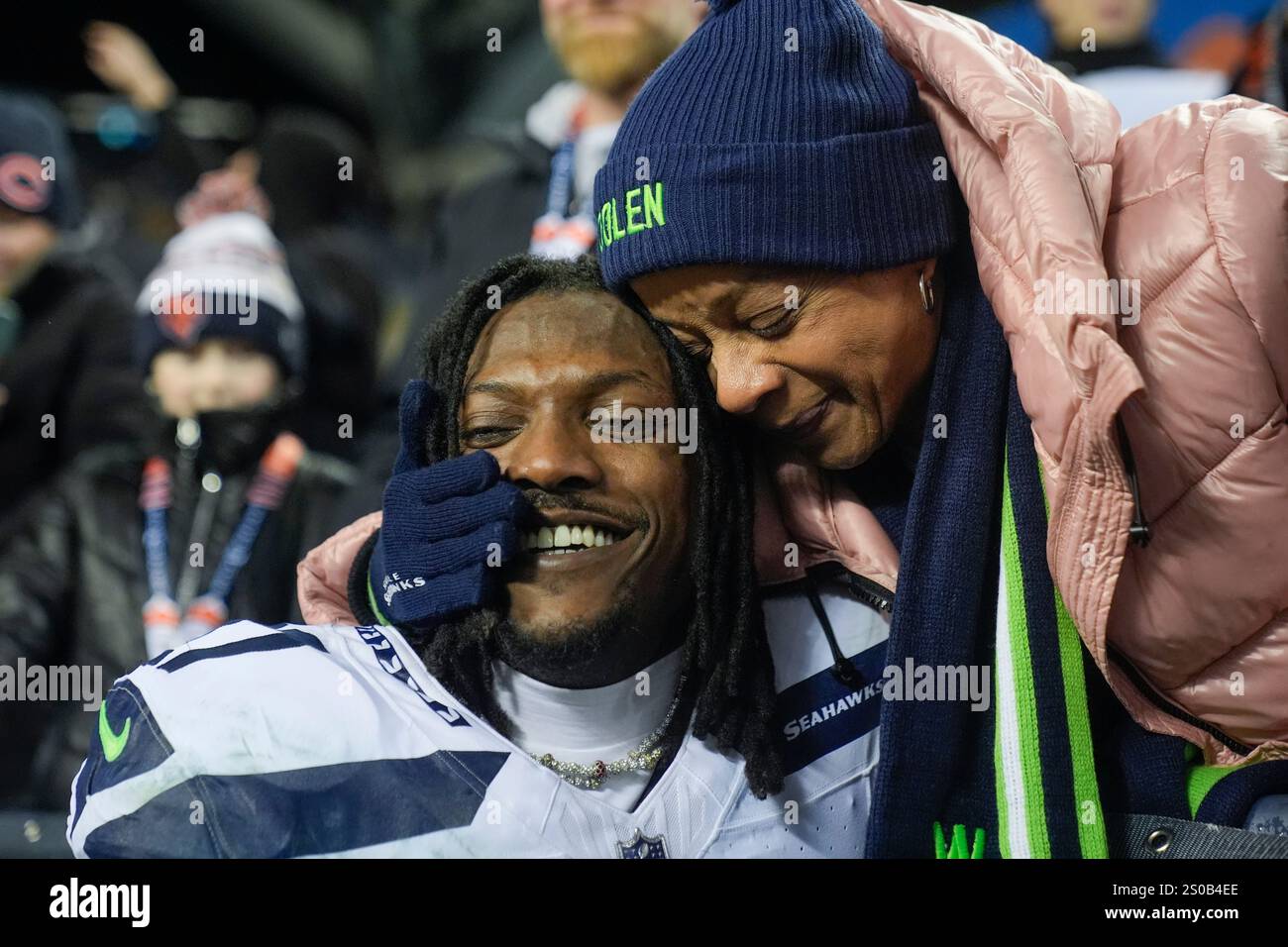 Seattle Seahawks cornerback Riq Woolen, left, shares a moment with his ...