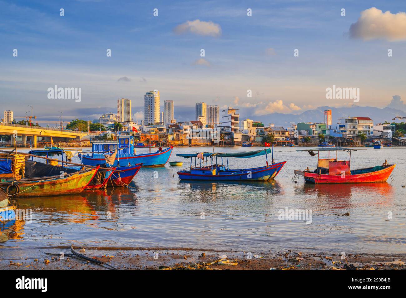 Traditional Vietnamese fishing boats and vessels in the harbor at sea ...