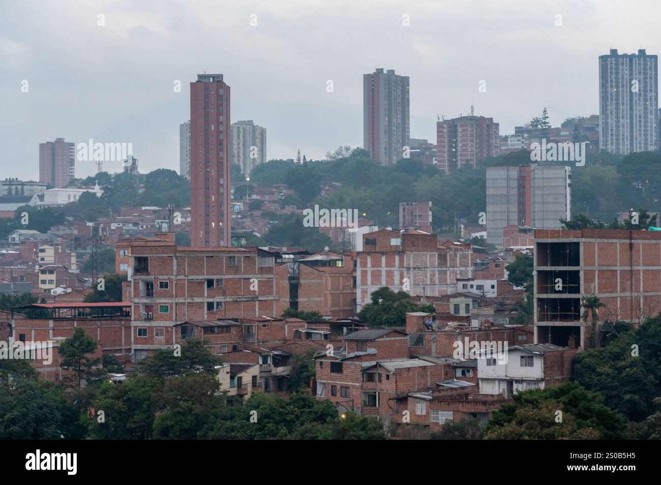 A cityscape blending modern high-rises with densely packed residential ...