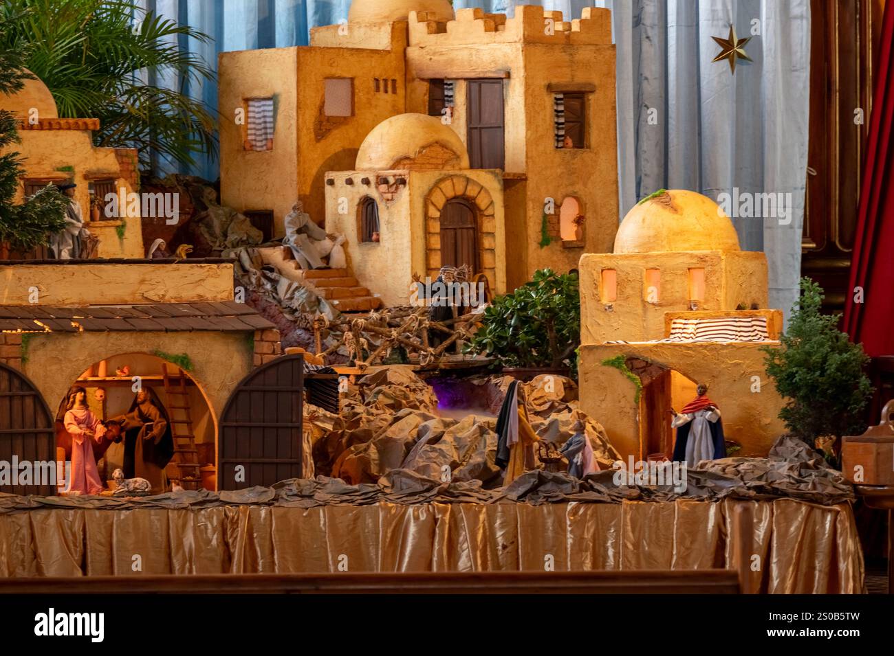 A handcrafted nativity scene, depicting the holy family and the village ...
