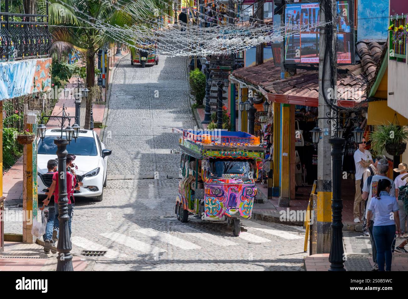 Vibrant street scene with colorful architecture and a unique mode of ...