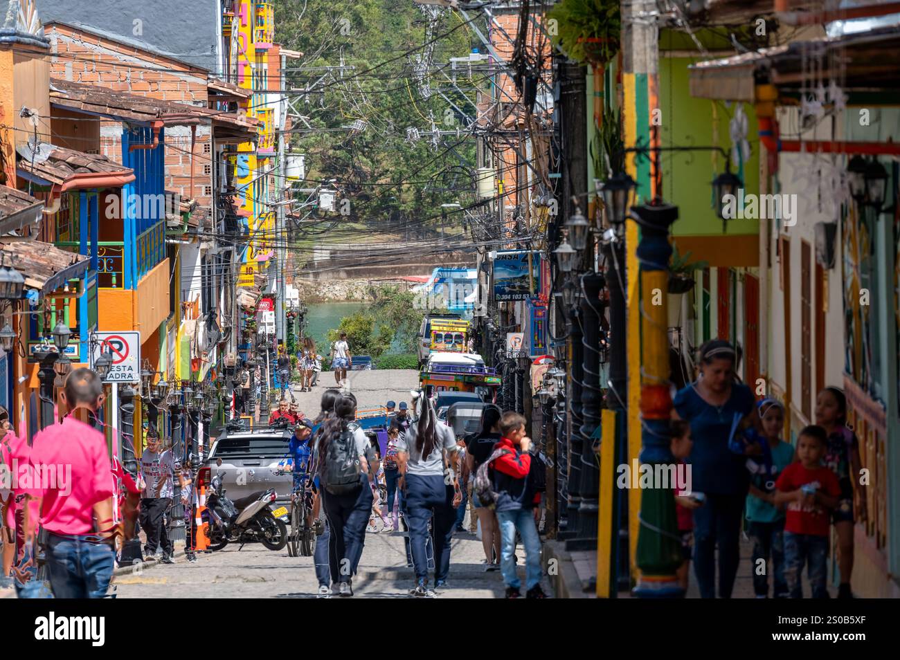 Vibrant street scene. Colorful buildings, bustling crowds, and a lively ...