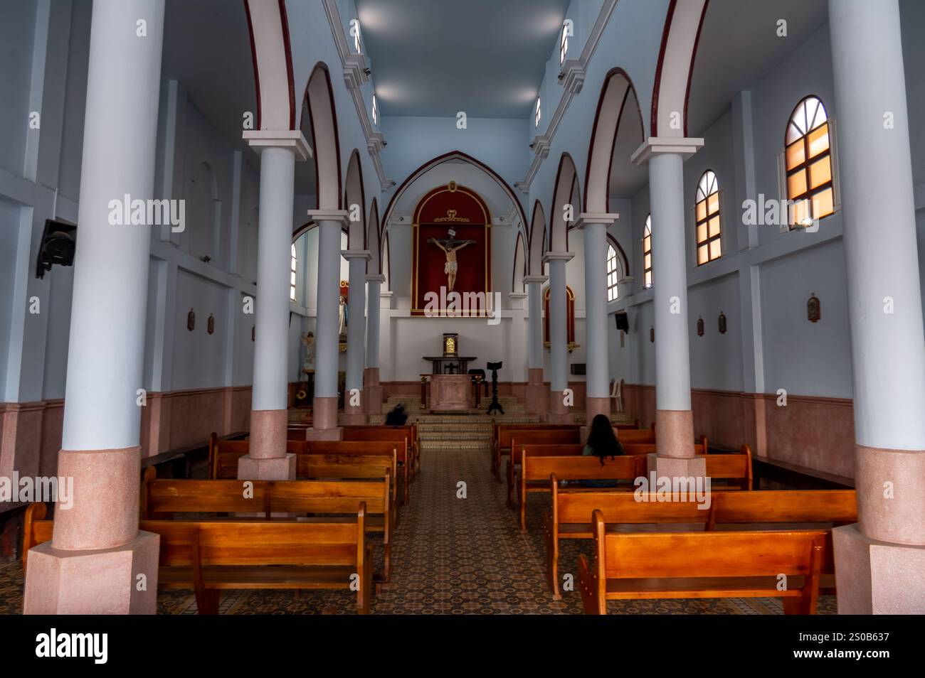 Serenity and reflection in a tranquil church. Light streams through ...