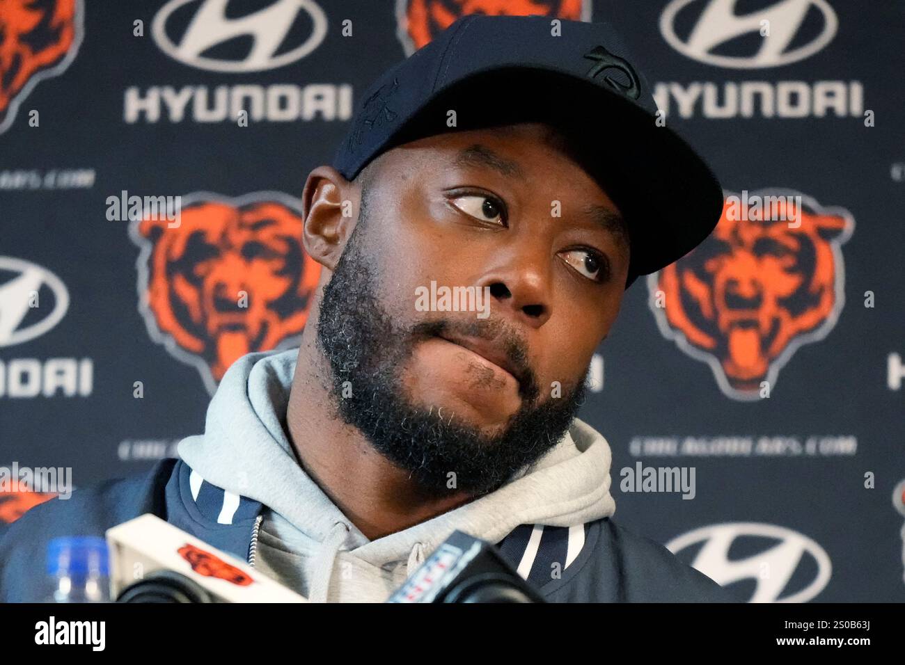 Chicago Bears interim head coach Thomas Brown listens to reporters ...