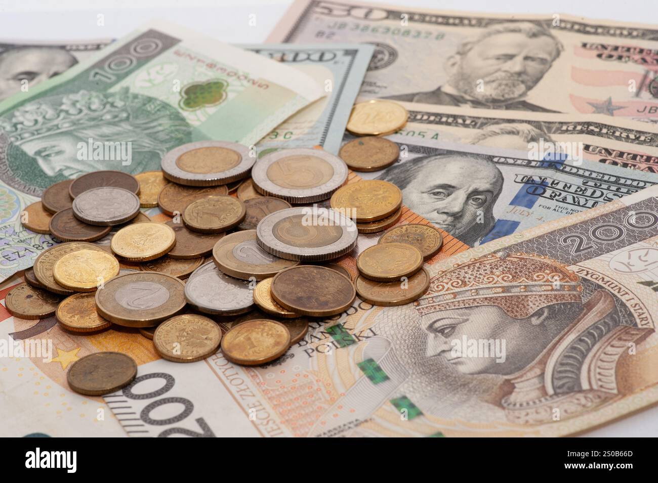 A pile of coins and bills including a 50 dollars bill. The coins are of ...