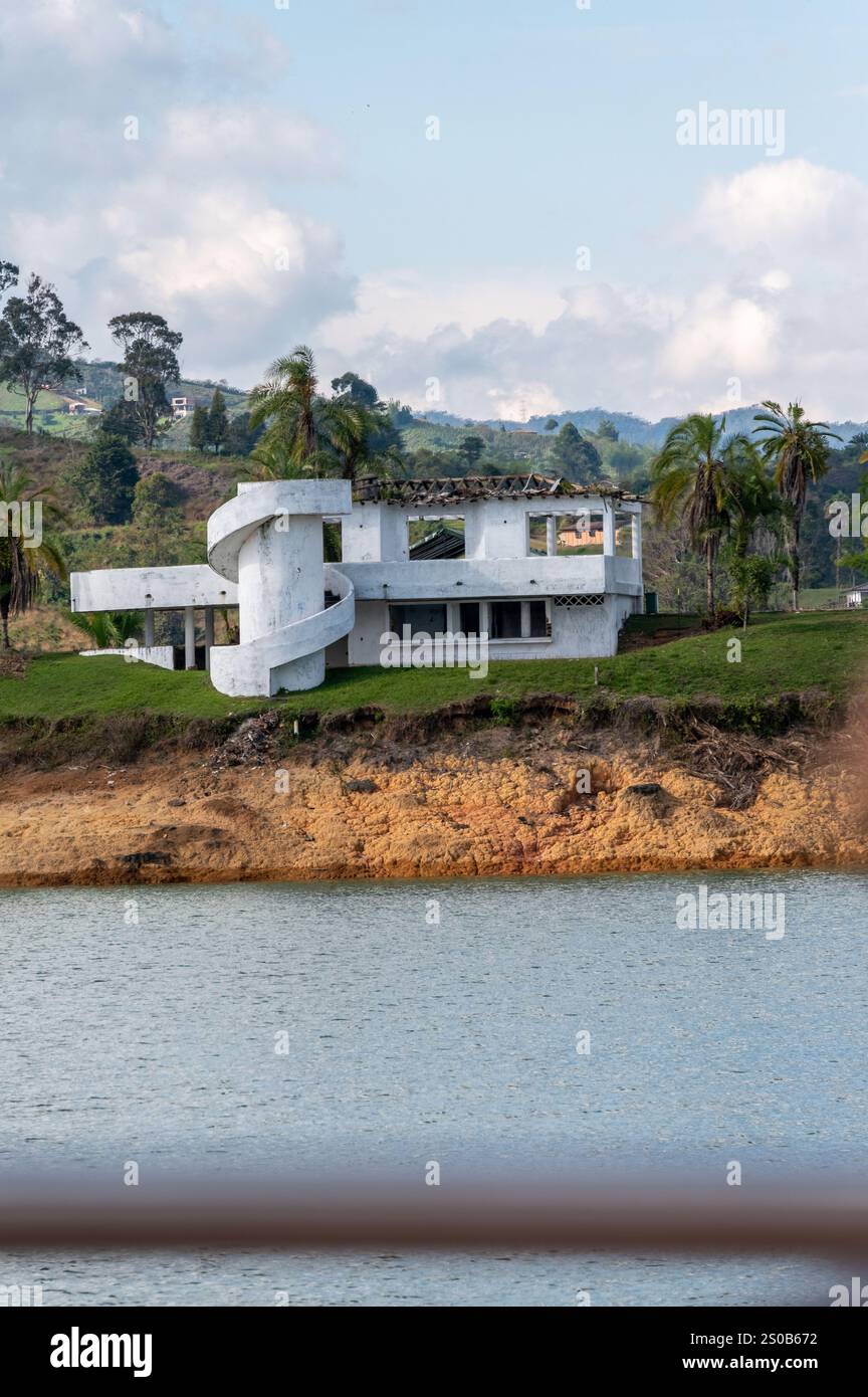 A serene lakeside view featuring a unique architectural structure ...