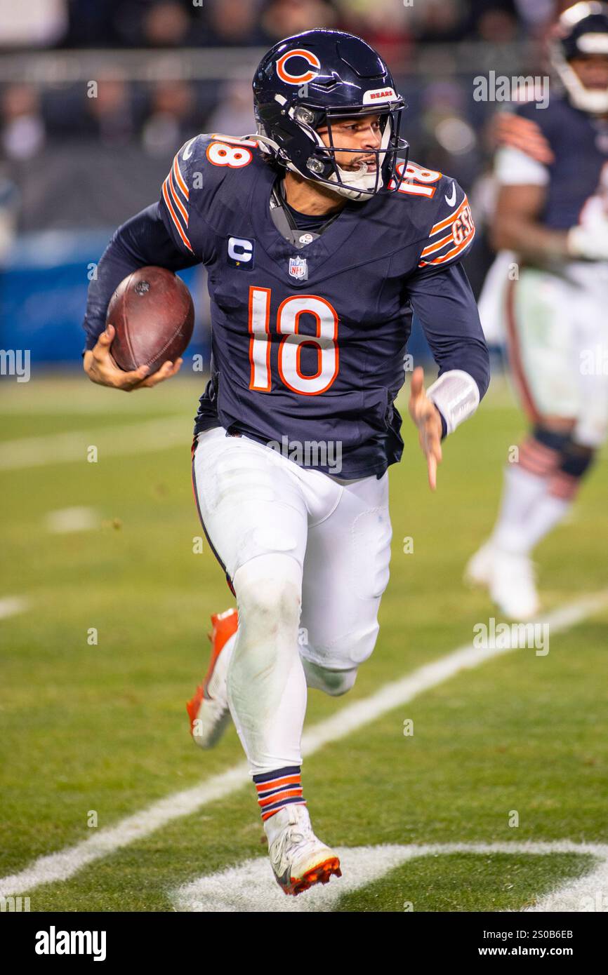 Chicago Bears quarterback Caleb Williams (18) runs with the ball during ...