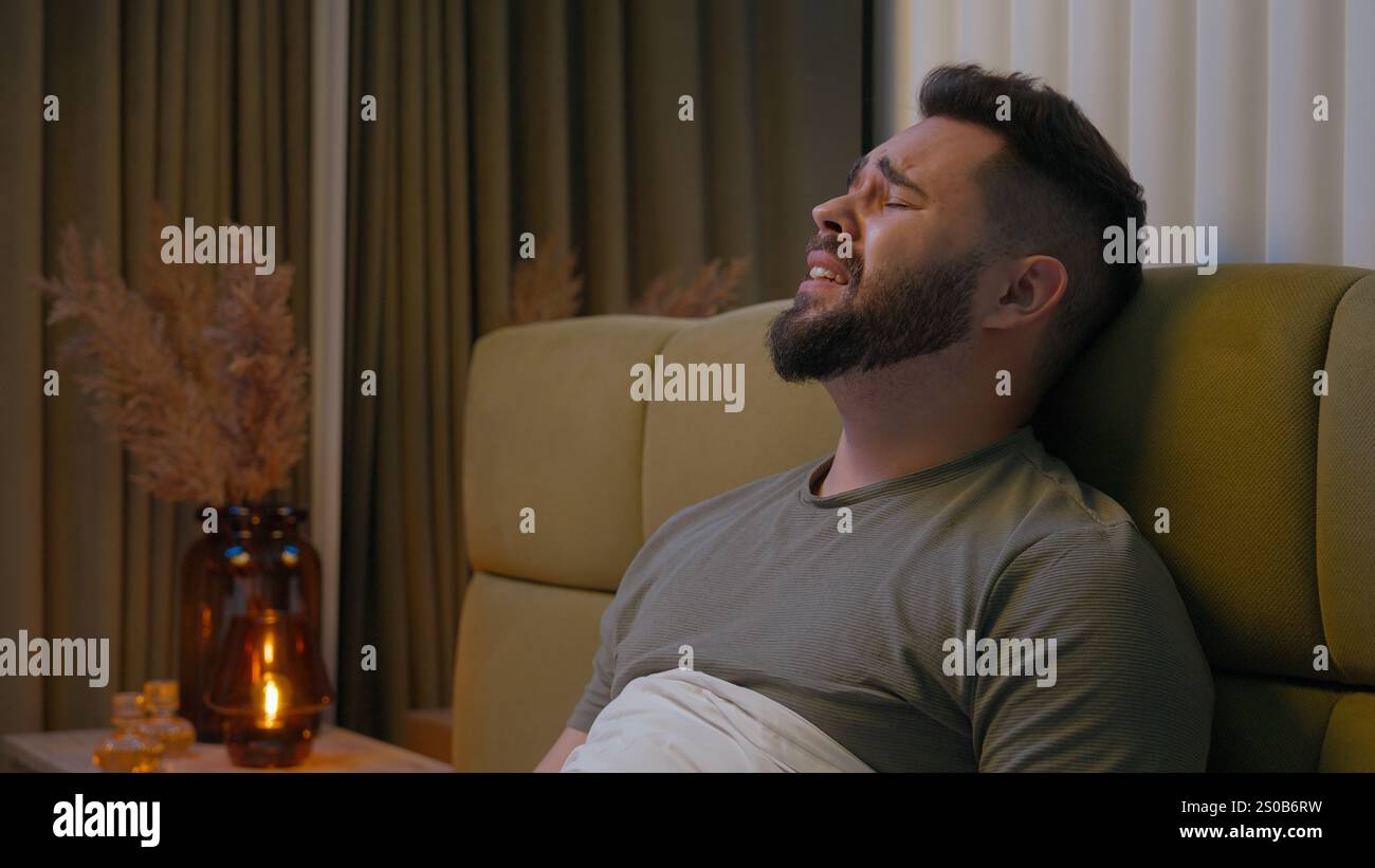 Frustrated man sitting bed screaming despair loss failure divorce ...