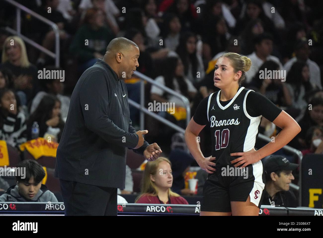 Santa Clara Broncos head coach Michael Floyd talks with forward Georgia ...