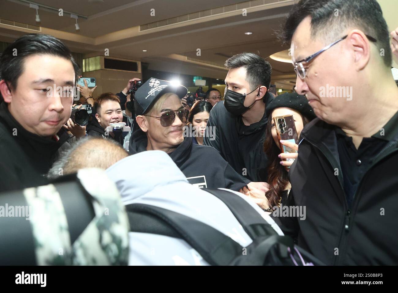 Hong Kong singer, dancer and actor Aaron Kwok arrives in Taipei City ...