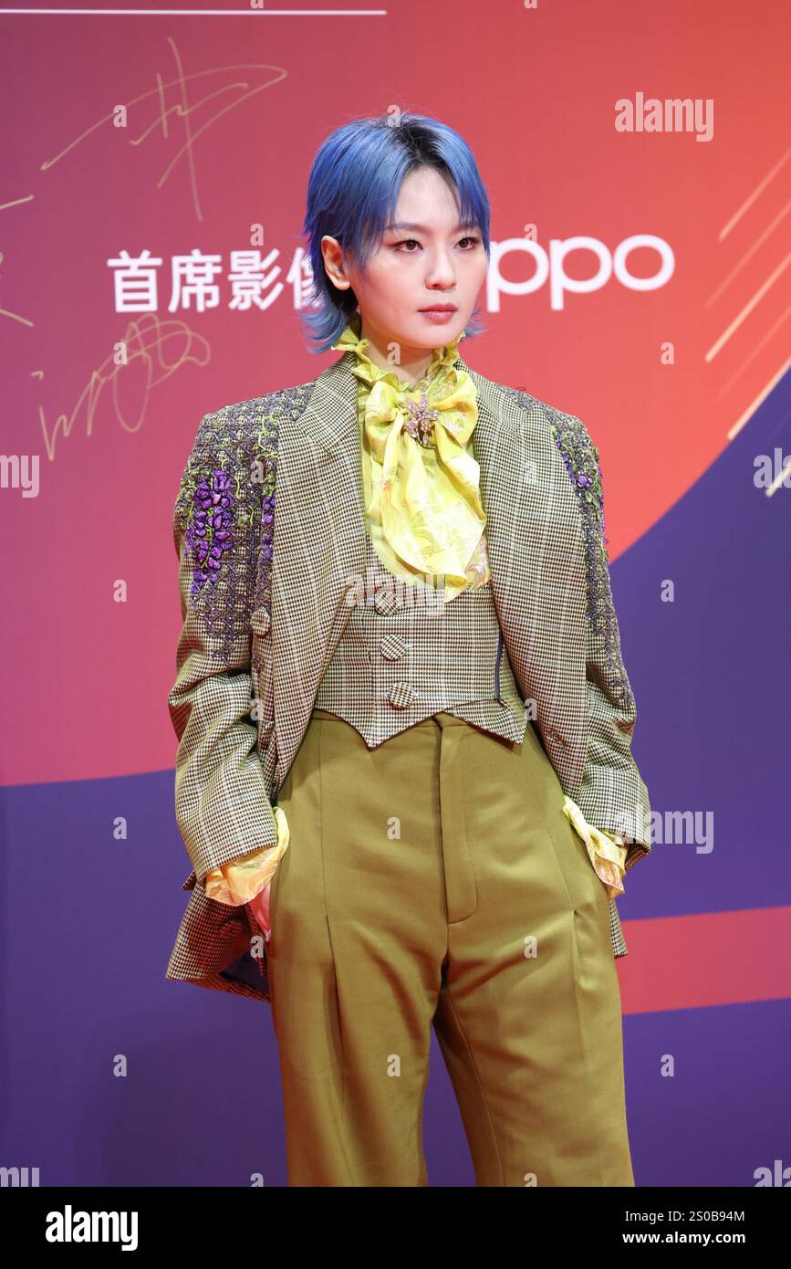 Chinese singer, songwriter, and actress Bibi Zhou attends an activity ...