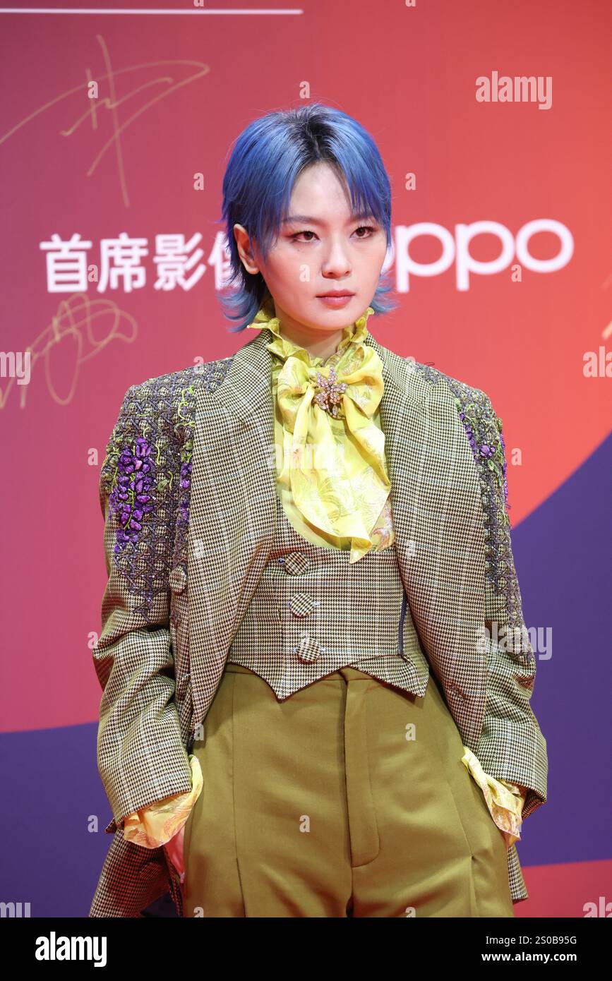 Chinese singer, songwriter, and actress Bibi Zhou attends an activity ...