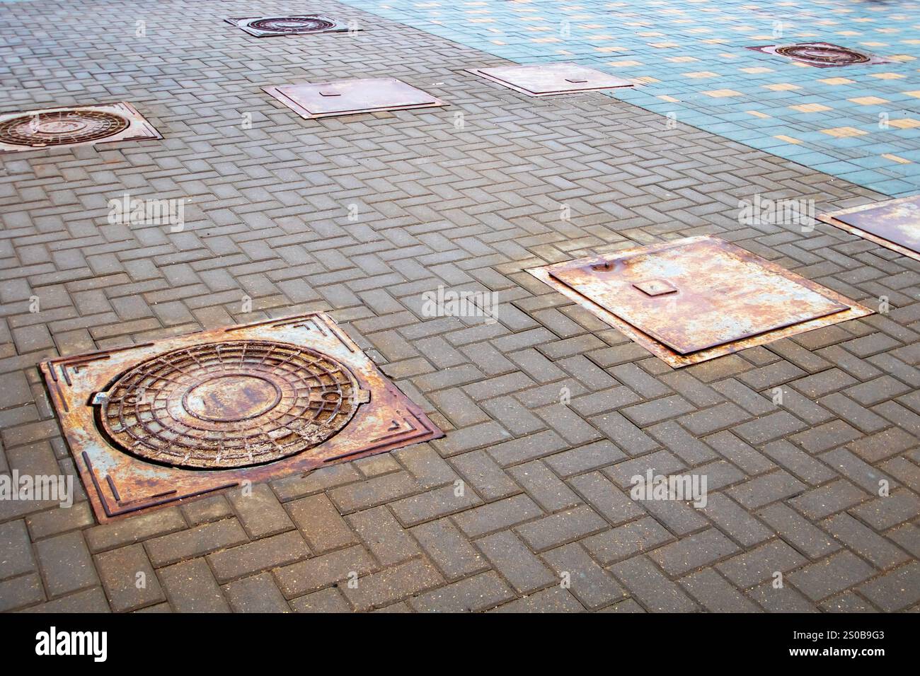 A continuous line of manhole covers set into a carefully designed brick ...
