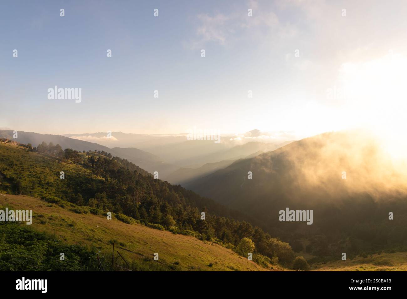 Mountain ranges with mist at sunset. Landscape of the mountains ...