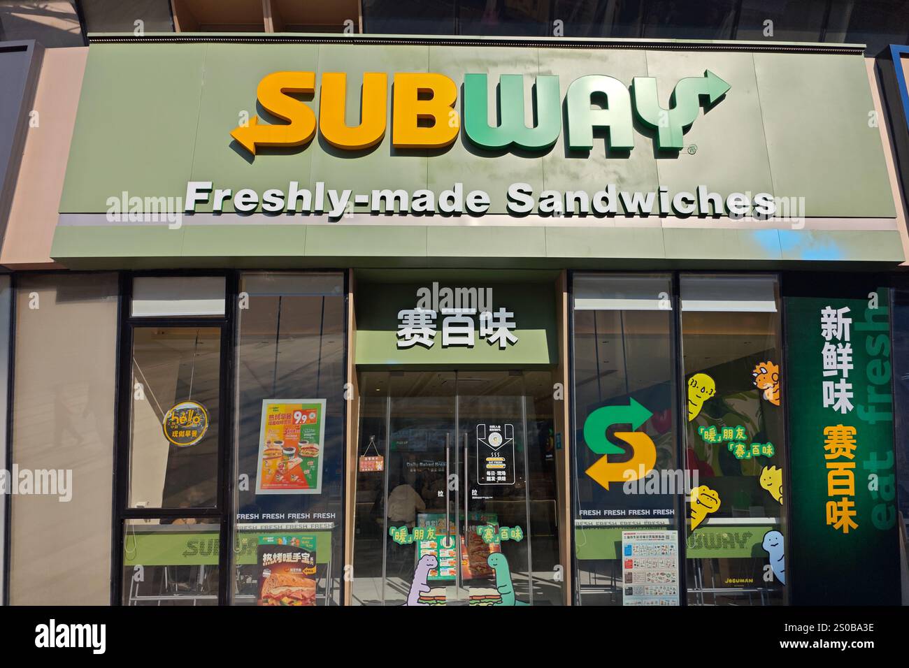 Citizens pass a SUBWAY fast food restaurant at the Pudong street in ...