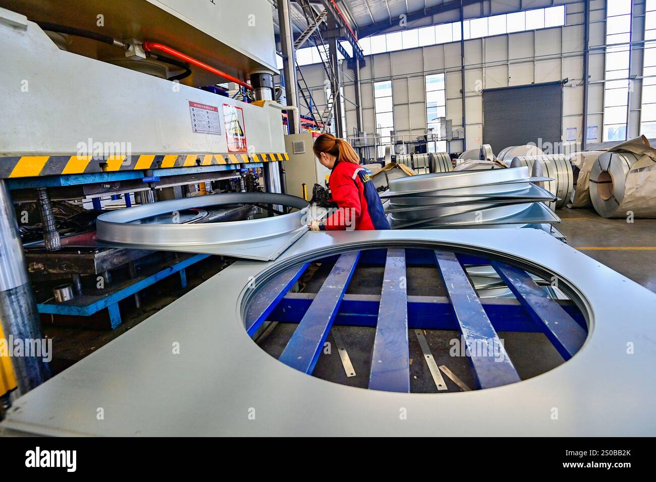 QINGZHOU, CHINA - DECEMBER 27, 2024 - A worker works in a workshop at a wind turbine ...