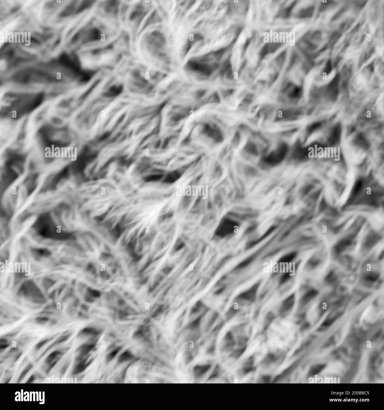 Defocused background of gray grass. Severe blurring of a tangled mass ...