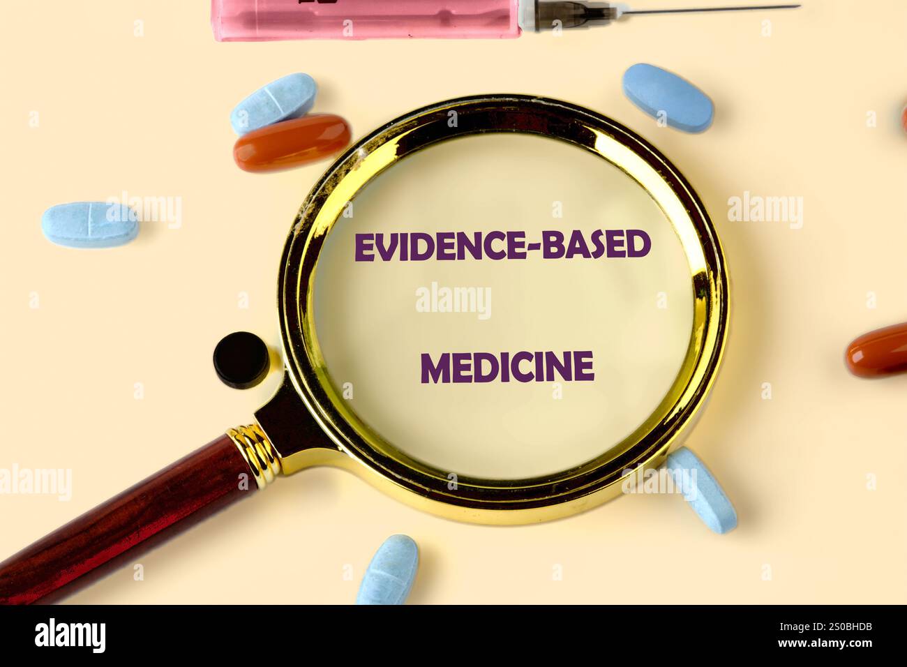 A magnifying glass highlights the phrase evidence-based medicine while ...