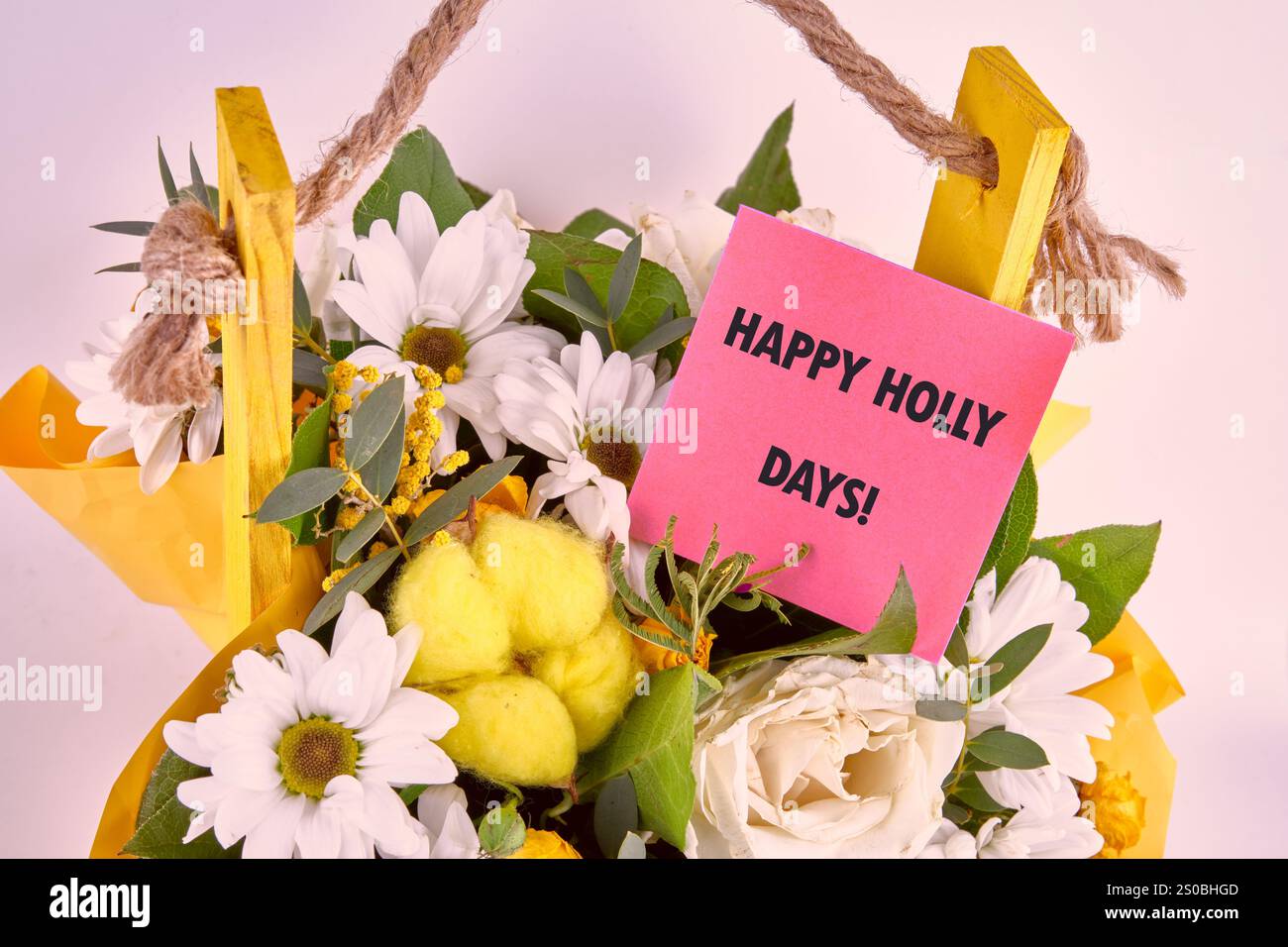 The concept of holidays. The phrase HAPPY HOLLY DAYS words on the ...