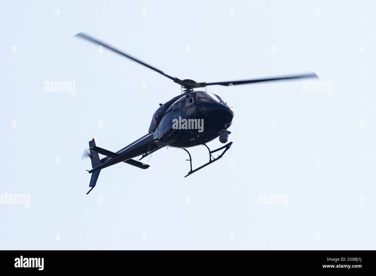 A low flying helicopter Stock Photo - Alamy