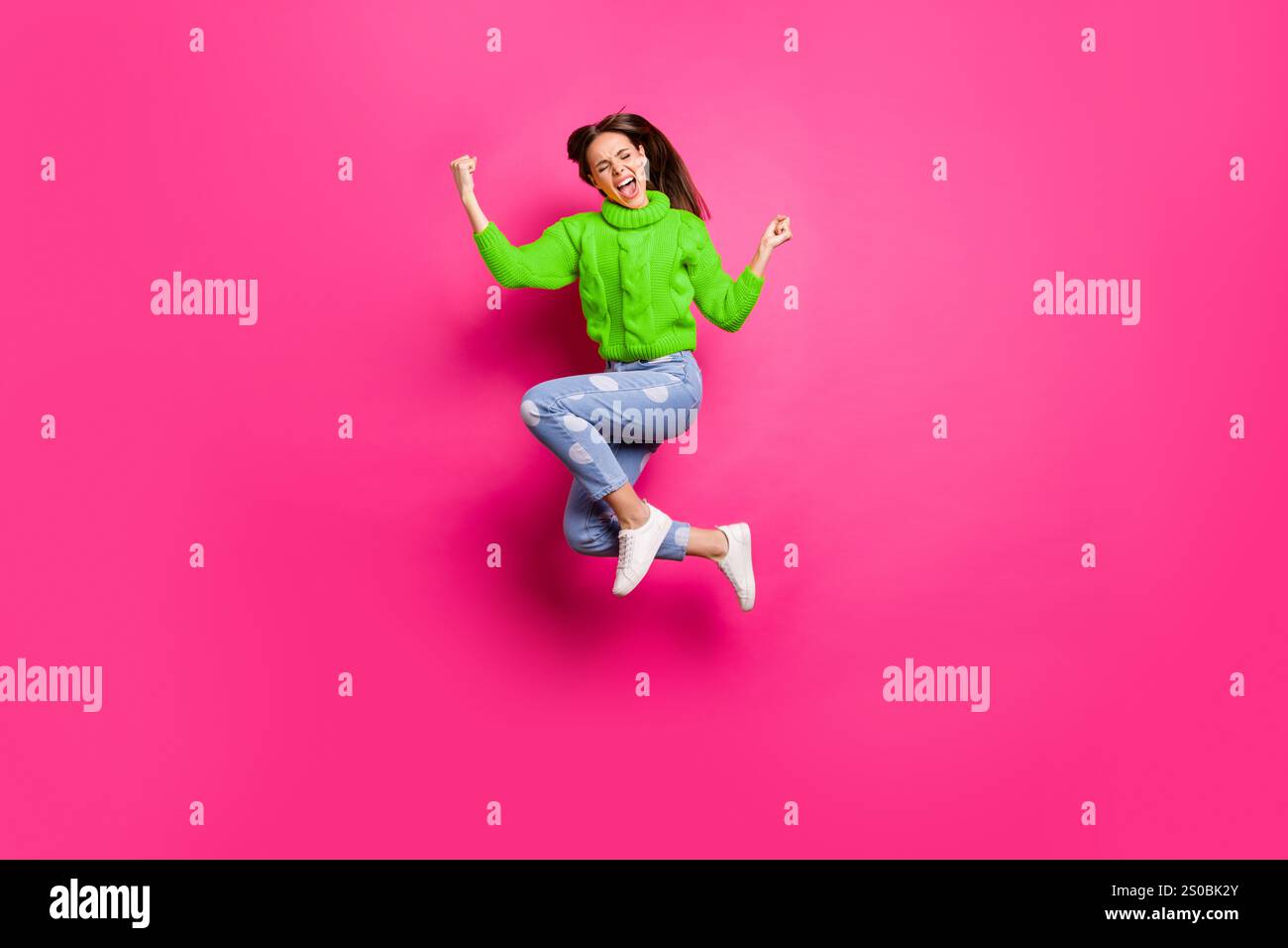 Full size photo of excited girl with her eyes closed jumping raising ...