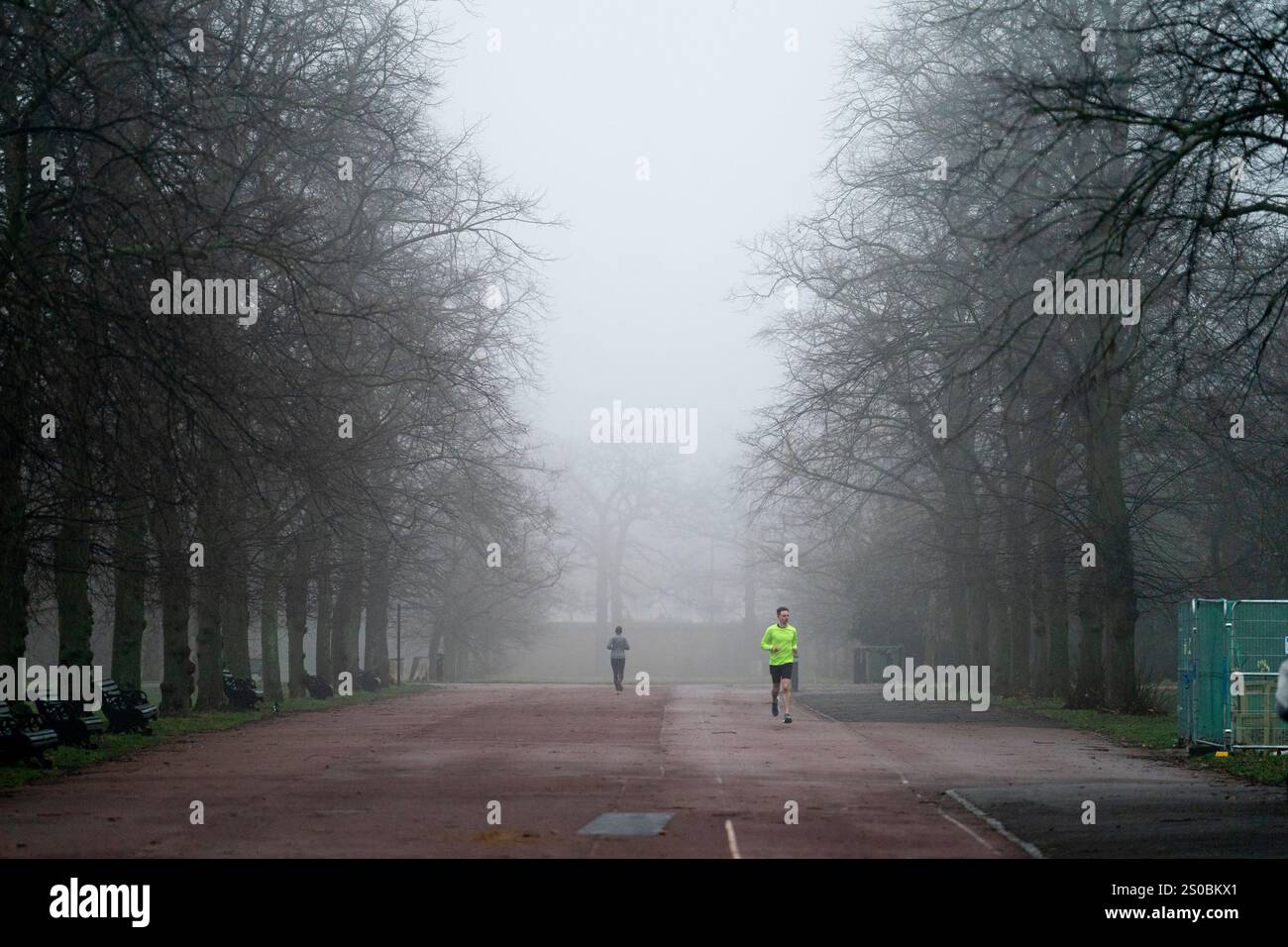 A jogger in foggy weather in Greenwich Park in London. The UK will have ...