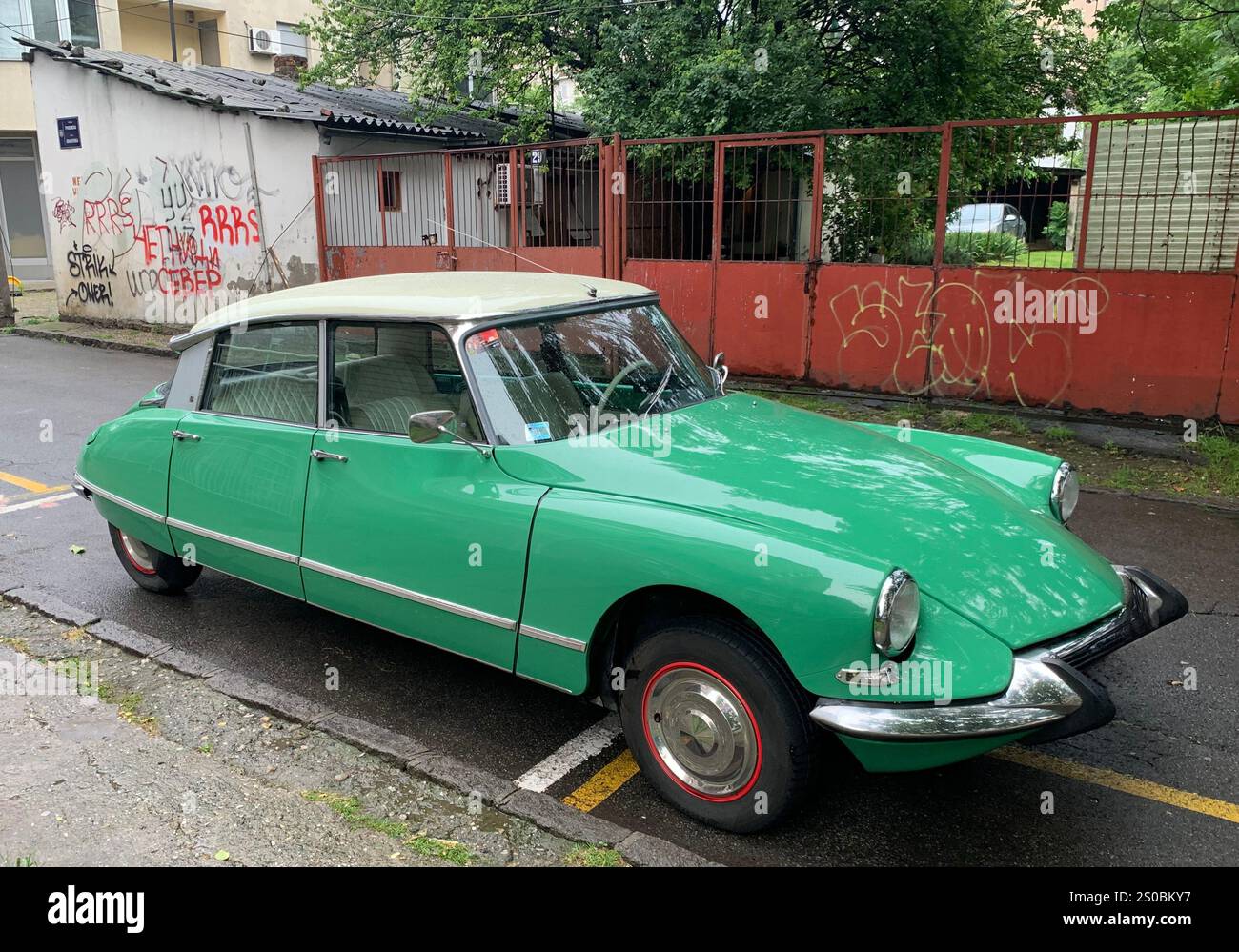 A charming old-fashioned French car parked on a street in Belgrade ...