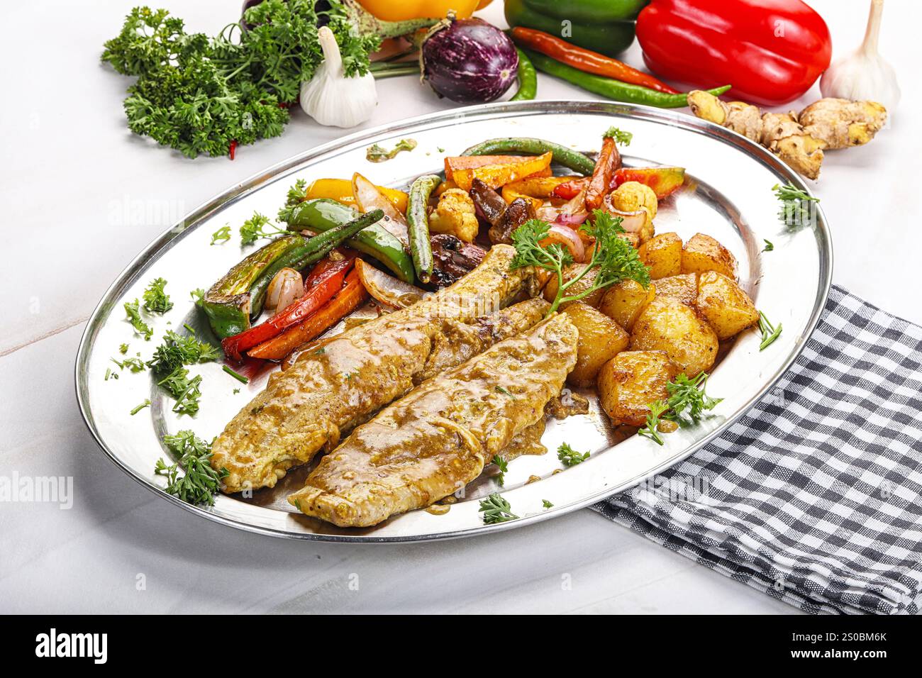 Roasted shark steak with potato and vegetable garnish Stock Photo - Alamy