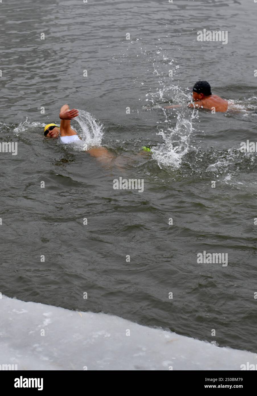 Winter swimming enthusiasts swim in the icy water in Korla City ...