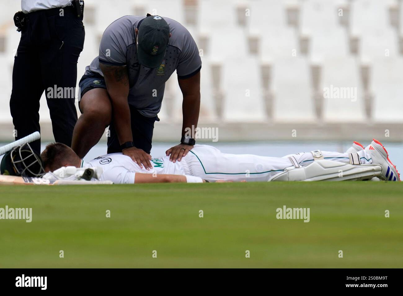 South Africa's Aiden Markam is attended by team physio Sizwe Hadebe ...