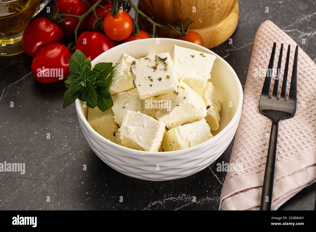 Greek traditional Feta cheese cubes with herbs and spices Stock Photo ...
