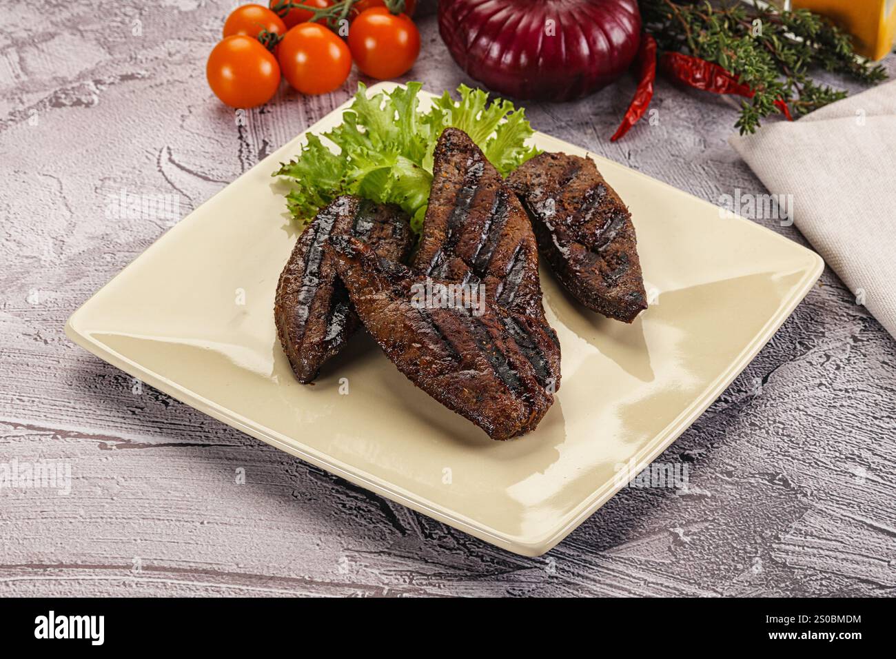 Grilled diet beef liver steak in the plate Stock Photo - Alamy