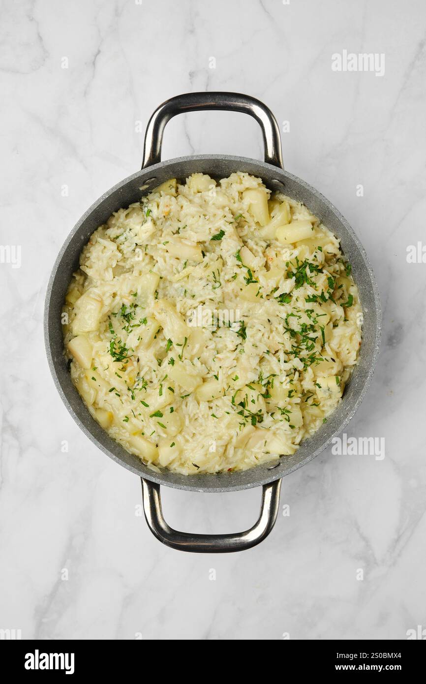 A delicious homemade rice and pear dish is served in a pot, featuring ...