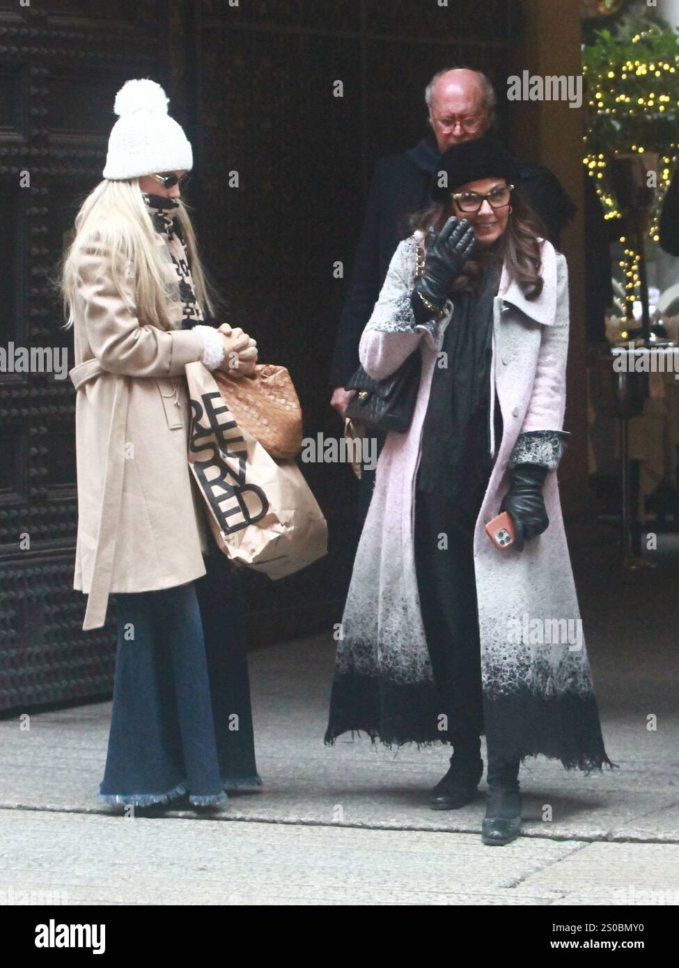 Milan, Italy. 14th Dec, 2024. Paulo Roberto Falcao with his wife Cristina Ranzolin and daughter ...